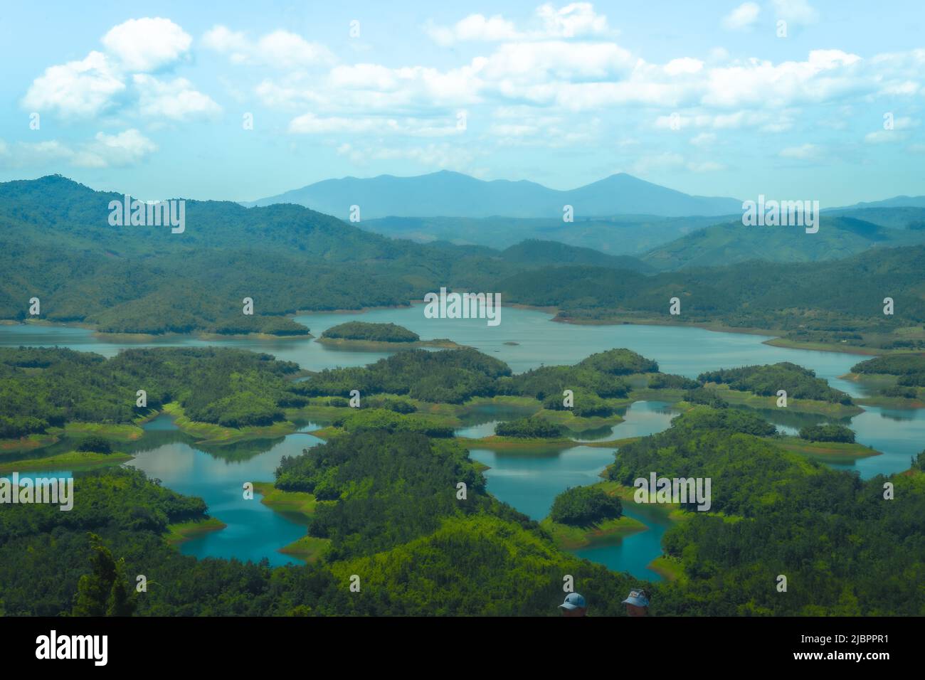 Morning at the Ta Dung lake or Dong Nai 3 lake with green hills and ...