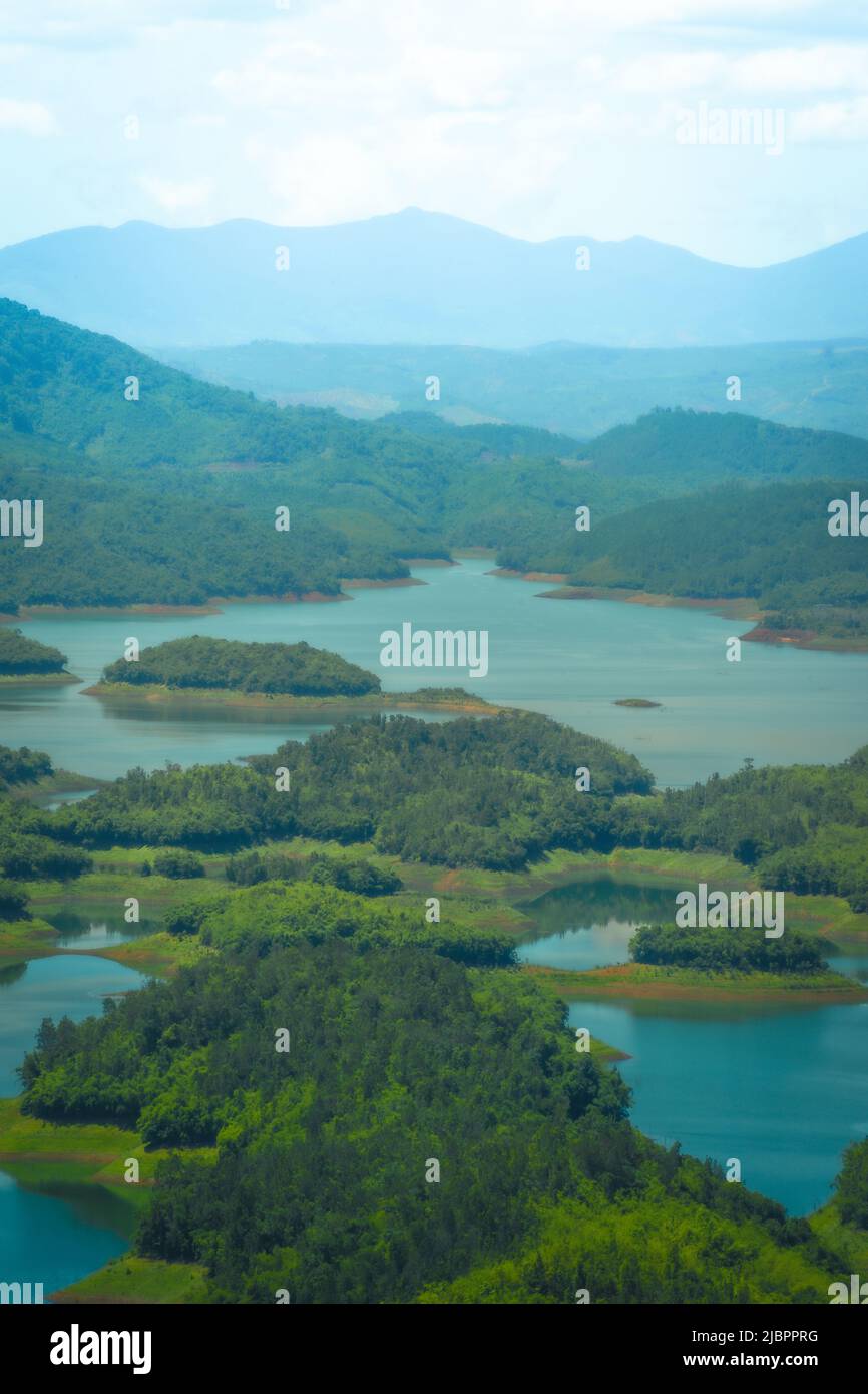 Morning at the Ta Dung lake or Dong Nai 3 lake with green hills and ...