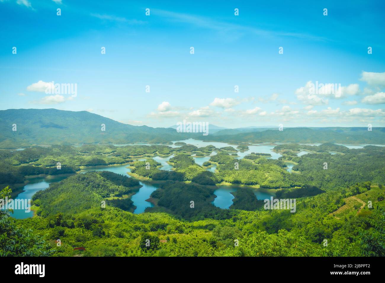 Morning at the Ta Dung lake or Dong Nai 3 lake with green hills and ...