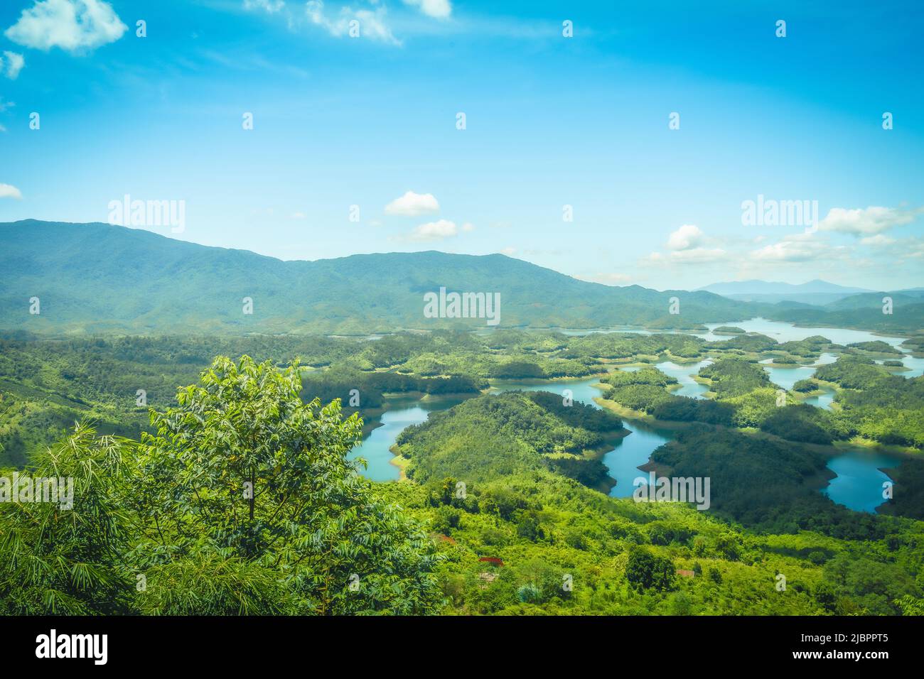 Morning at the Ta Dung lake or Dong Nai 3 lake with green hills and ...