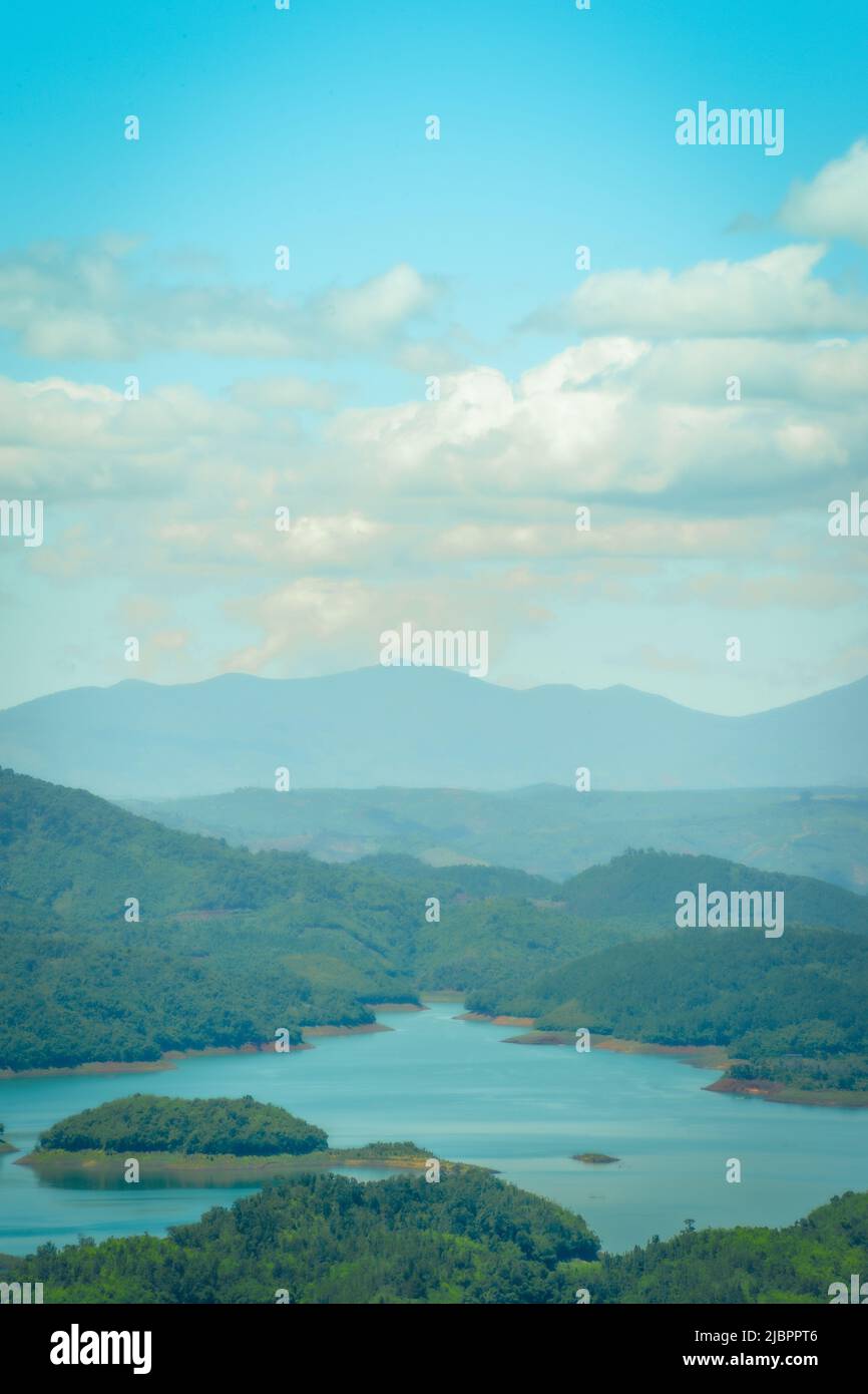 Morning at the Ta Dung lake or Dong Nai 3 lake with green hills and ...