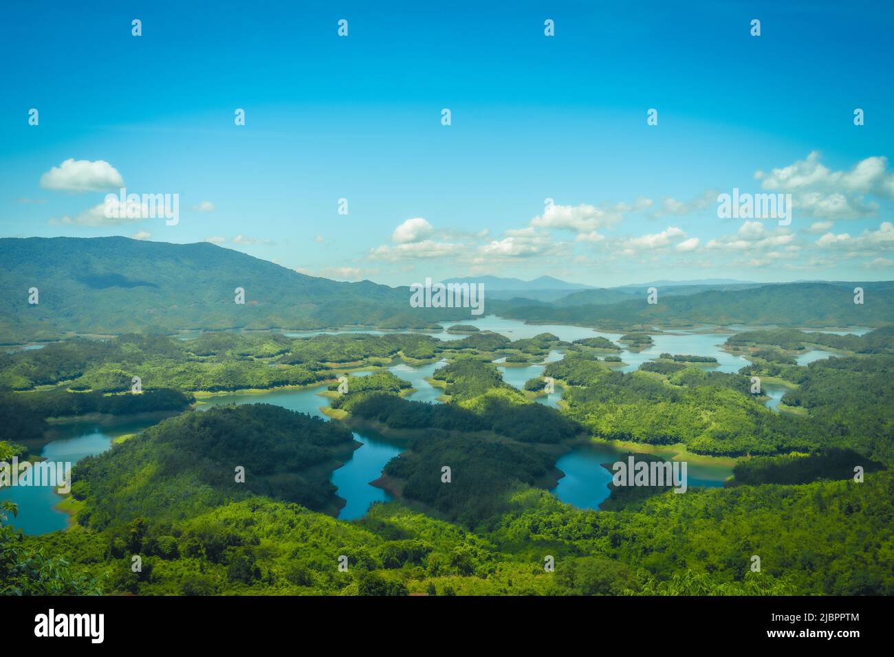 Morning at the Ta Dung lake or Dong Nai 3 lake with green hills and ...