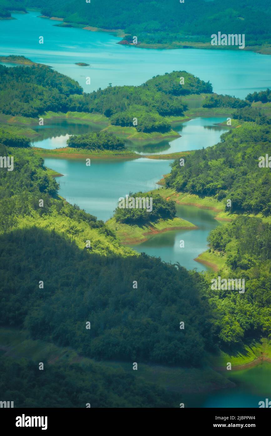 Morning at the Ta Dung lake or Dong Nai 3 lake with green hills and ...
