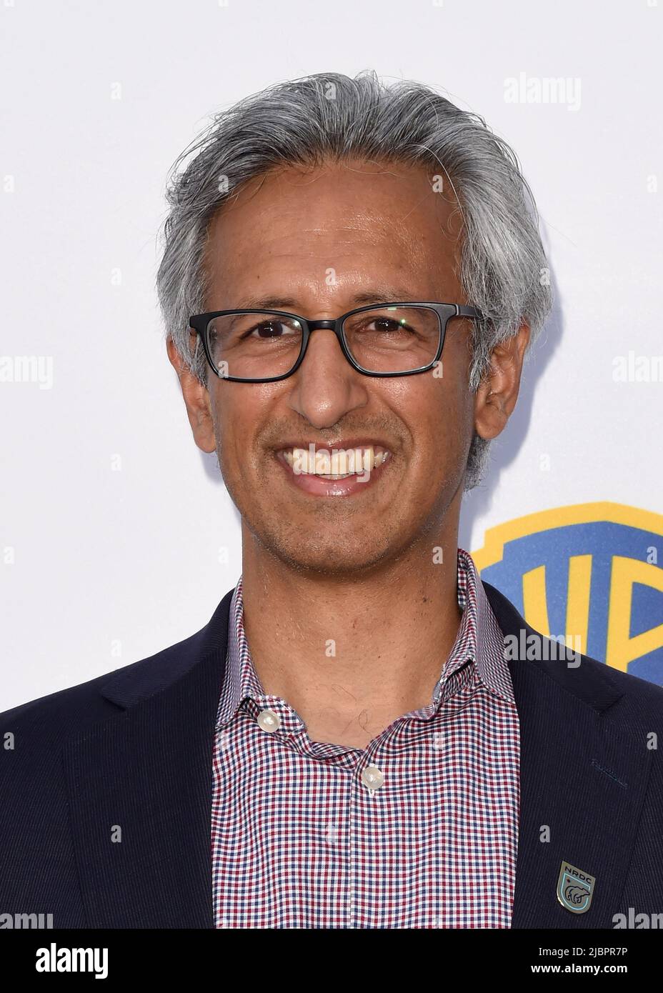 Manish Bapna walking on the red carpet at the NRDC night of Comedy at ...