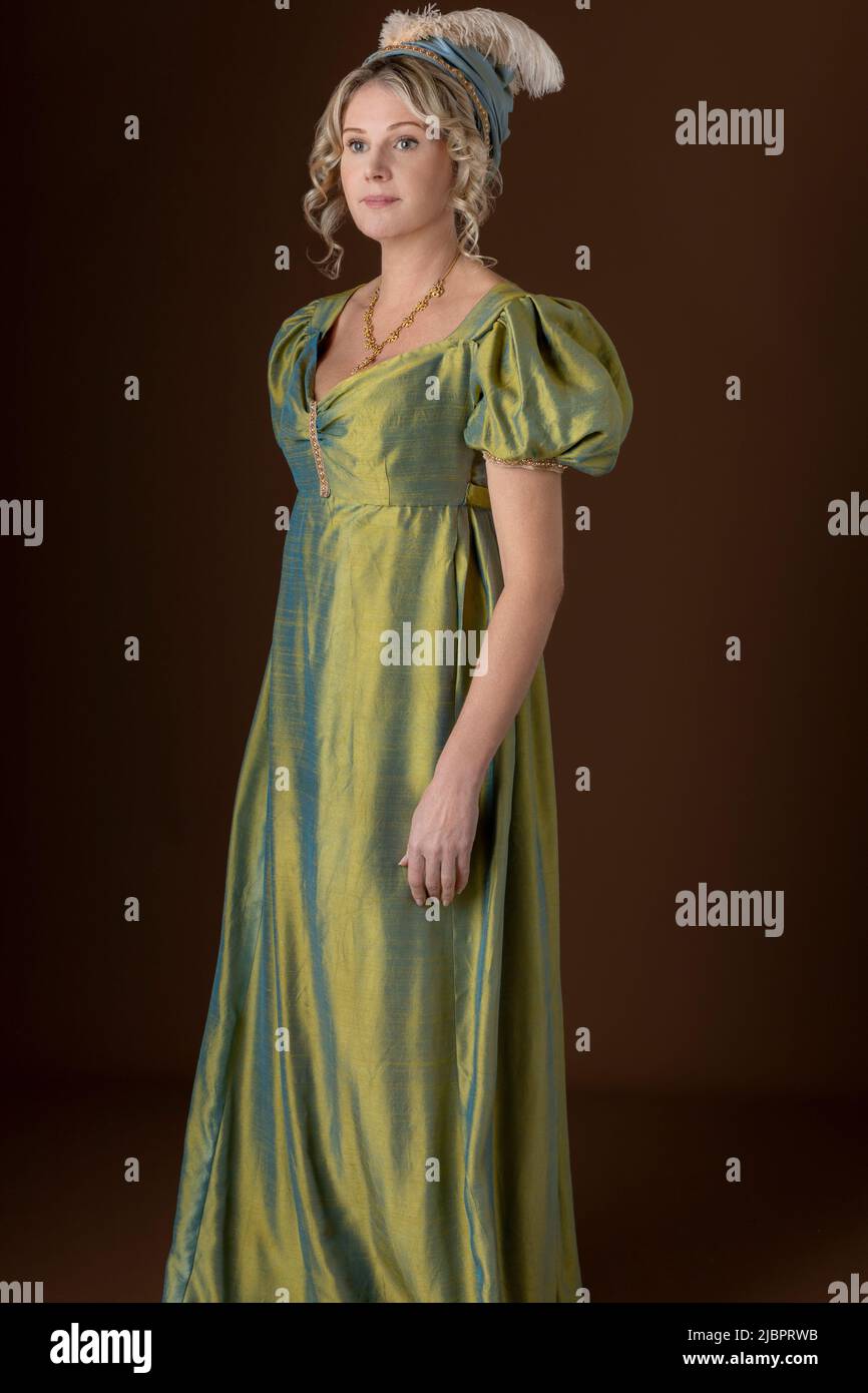 A Regency woman wearing a green shot silk dress and turban Stock Photo ...