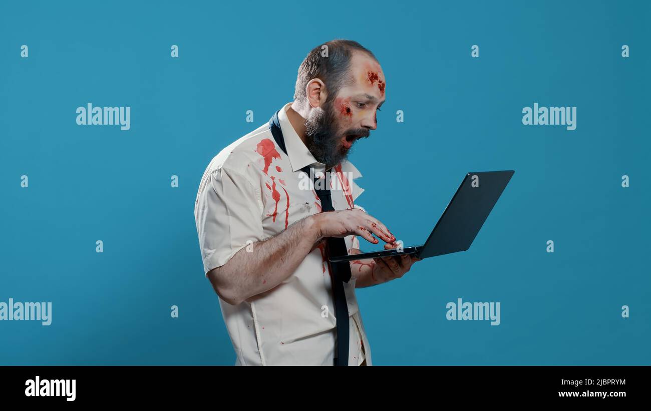 Dirty spooky zombie with open bloody wounds and scars using modern ...