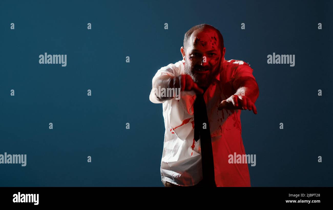 Frightening zombie surrounded by police on blue background. Aggressive ...