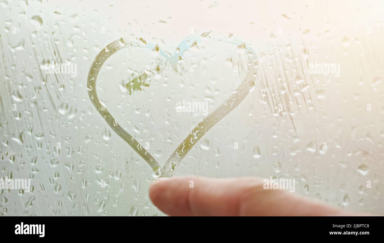 Finger draws heart window hi-res stock photography and images - Alamy
