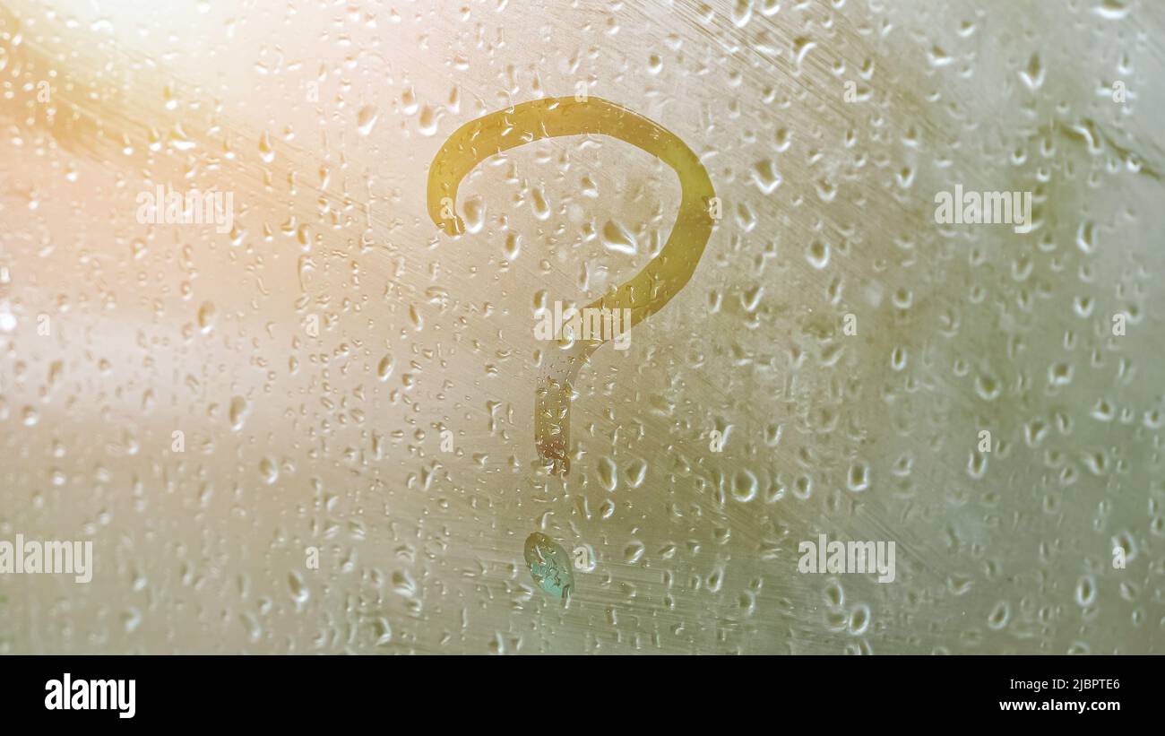 question mark on misty glass in rainy weather Stock Photo - Alamy