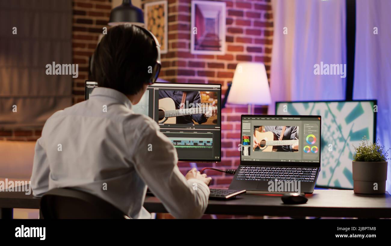 Graphic designer editing video montage on production software, working ...