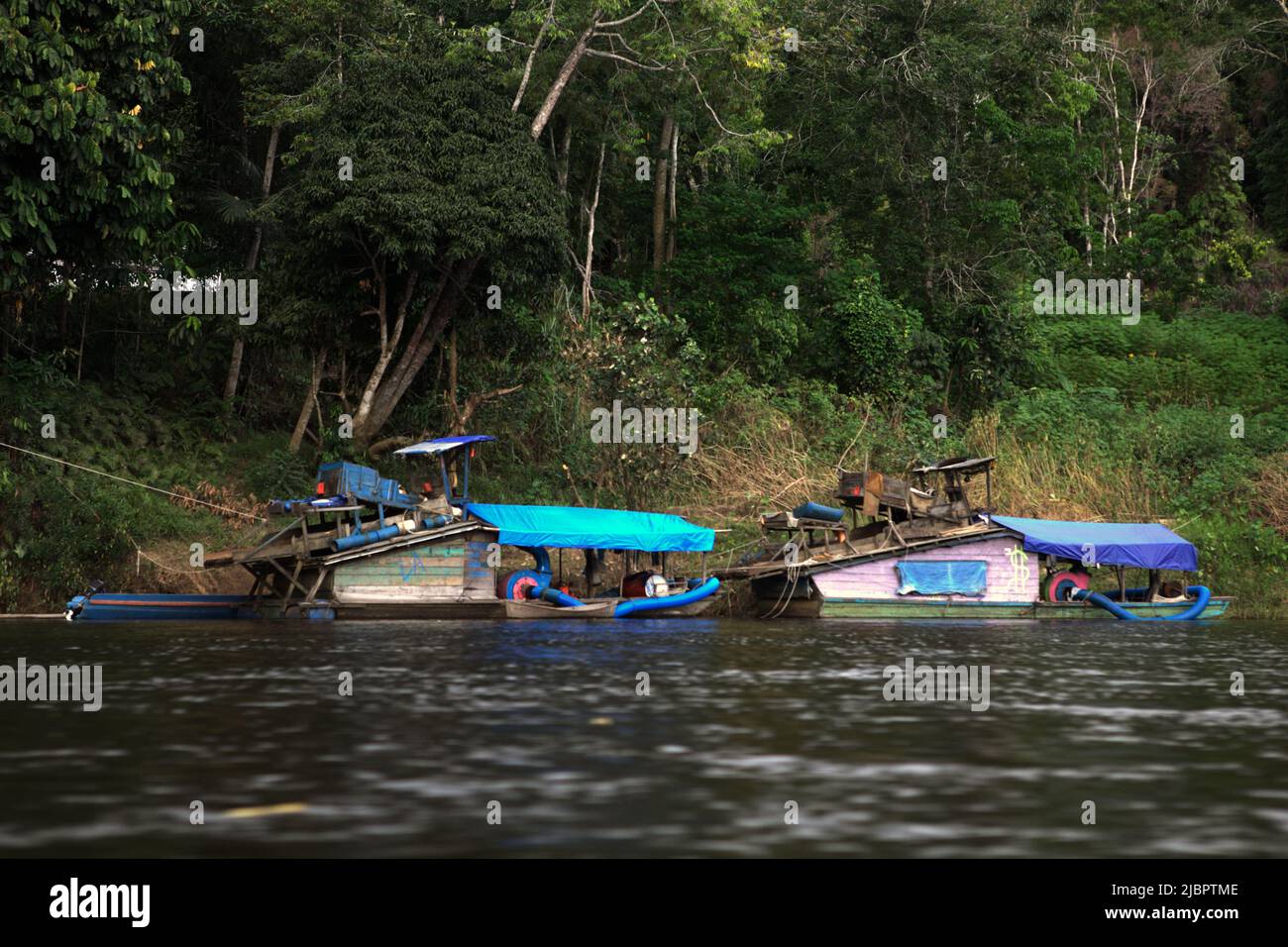 River boats equipped with sluice box to mine gold on Manday river in ...