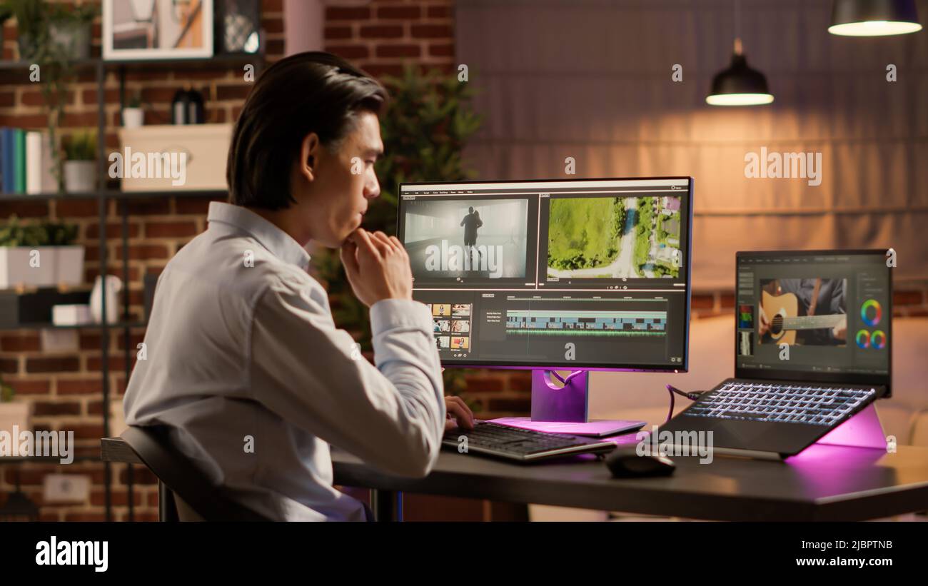 Graphic designer developing movie content on editing software, using ...