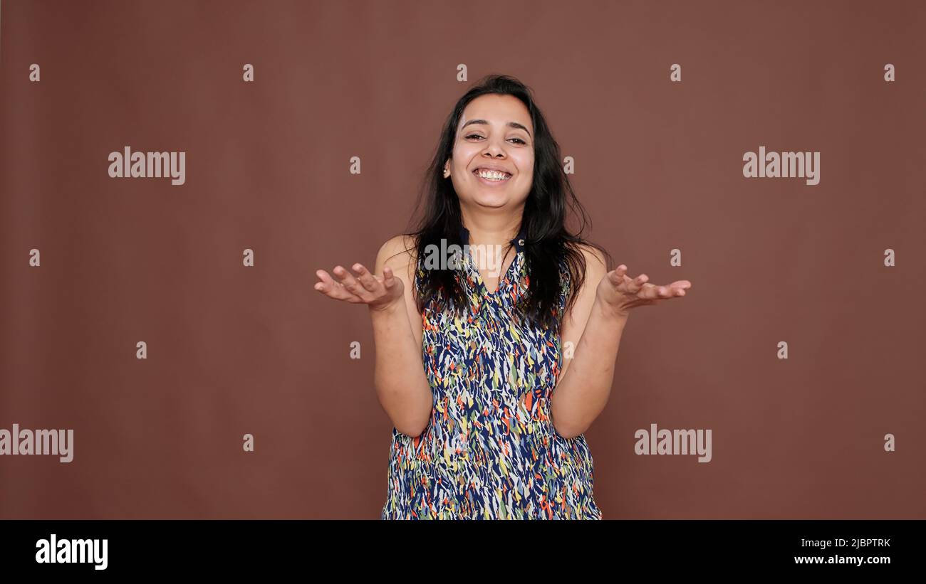 Portrait of indian model feeling excited and positive about news ...