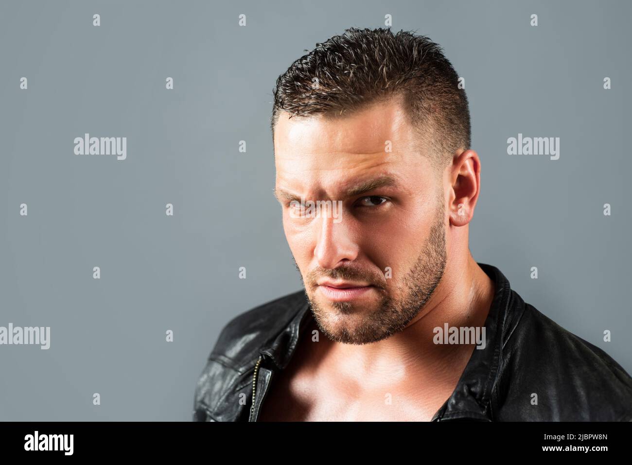 Close up portrait of guy with serious profile face. Brutal angry gang ...