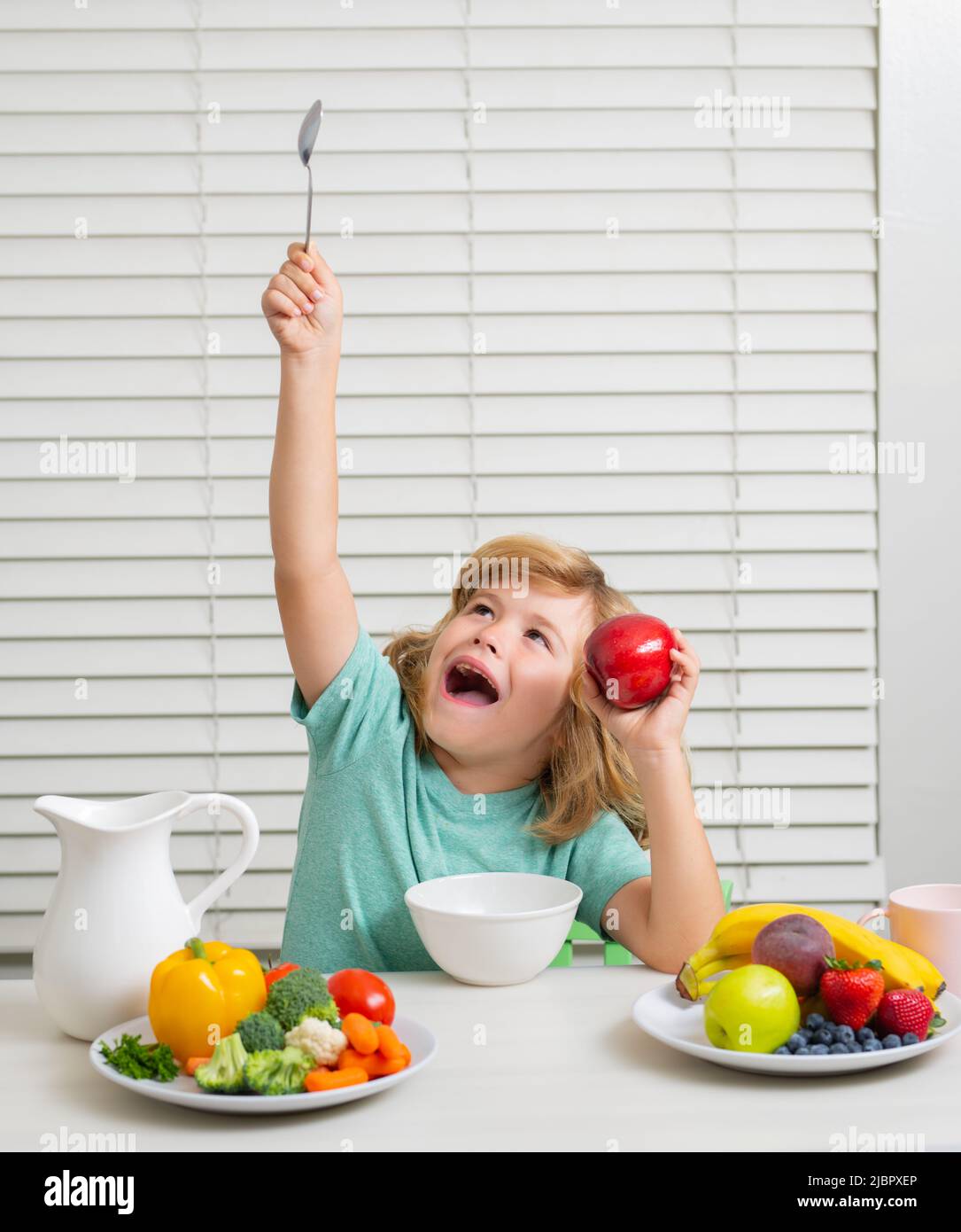 Little excited amazed child boy having healthy breakfast. Children ...