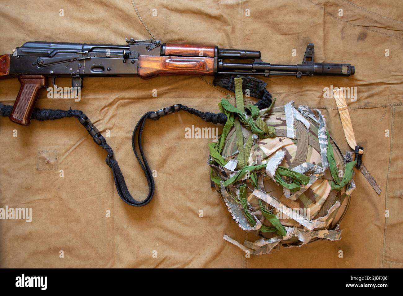 Combat machine and armored helmet camouflage on a green background ...