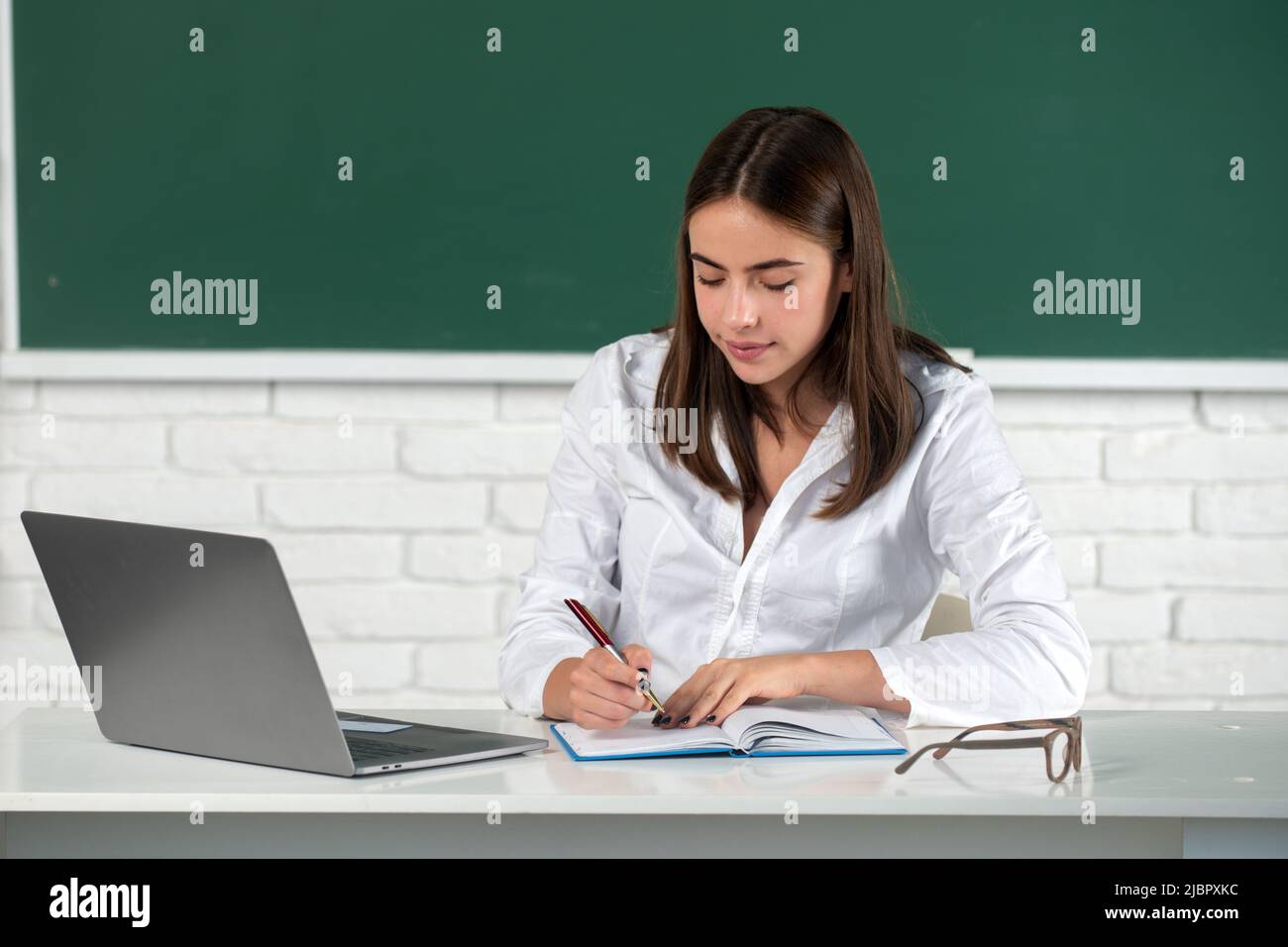 High school student learning english or mathematics in class. Female ...