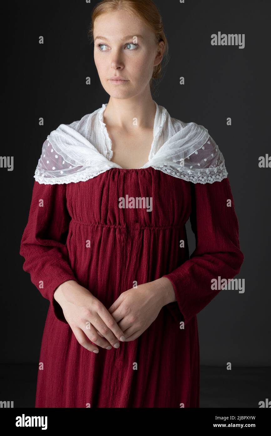 A working class Regency woman wearing a red dress Stock Photo - Alamy