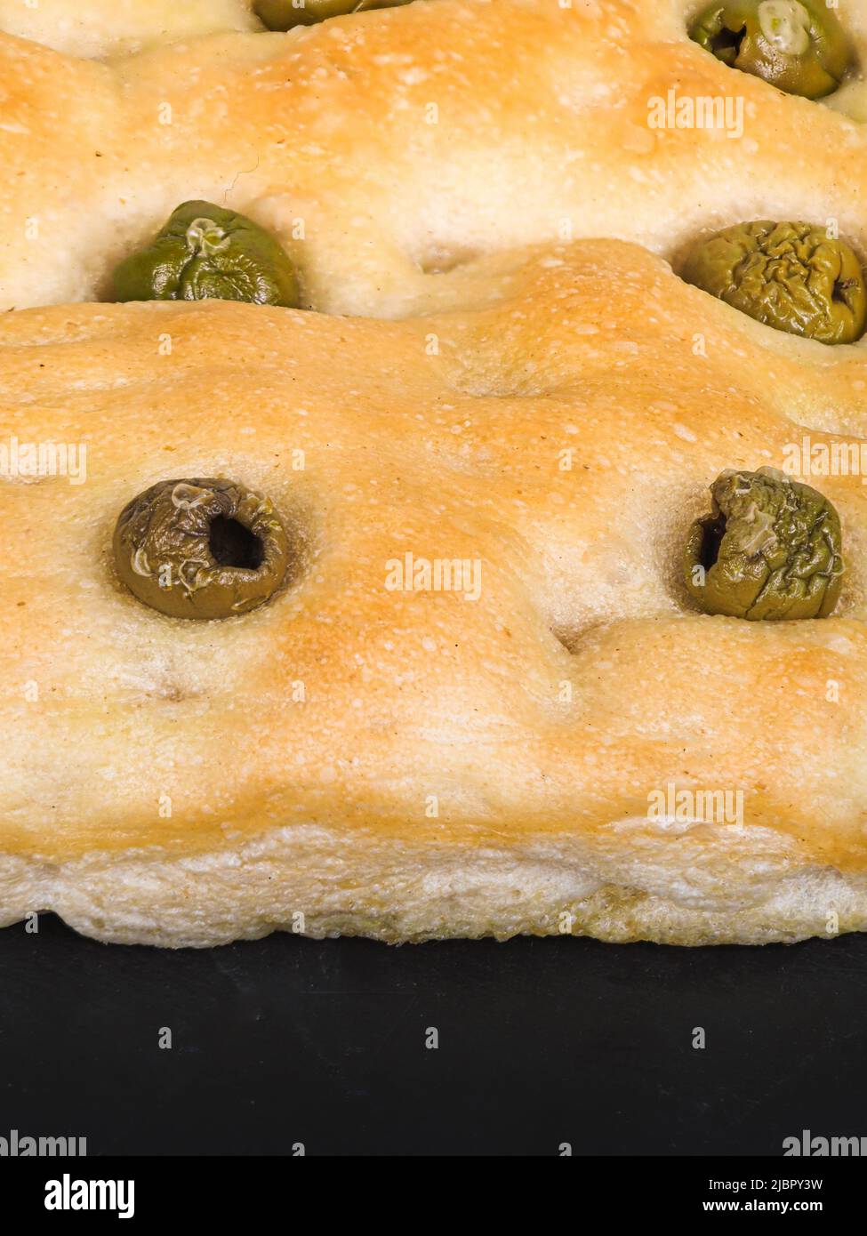 Italian flat bread organic wholewheat focaccia with whole green olives ...