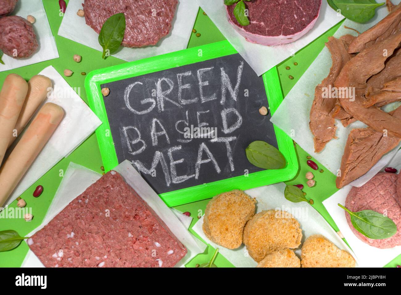 Lab-grown or plant based red meat steaks over green background Stock ...