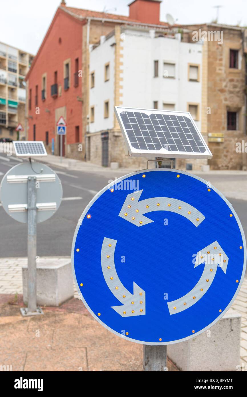 Roundabout sign powered by solar panel. Environmentally friendly ...