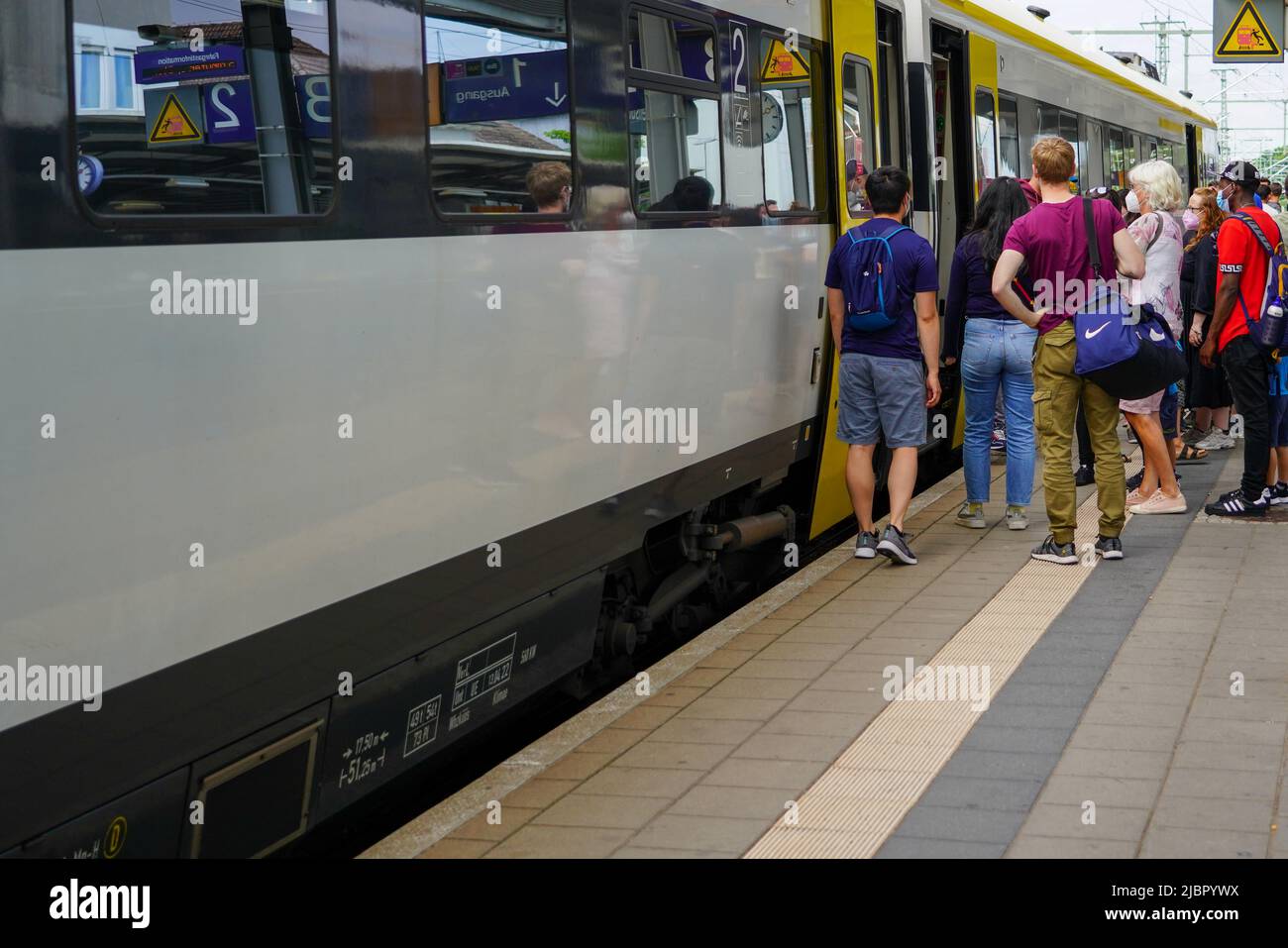 Passengers on a platform at Ravensburg railway Station wait for entry ...