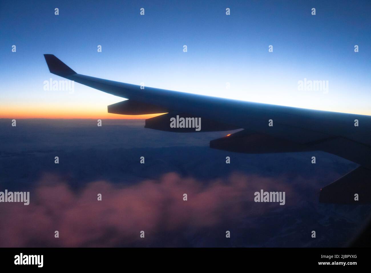 Plane at sunset Stock Photo - Alamy