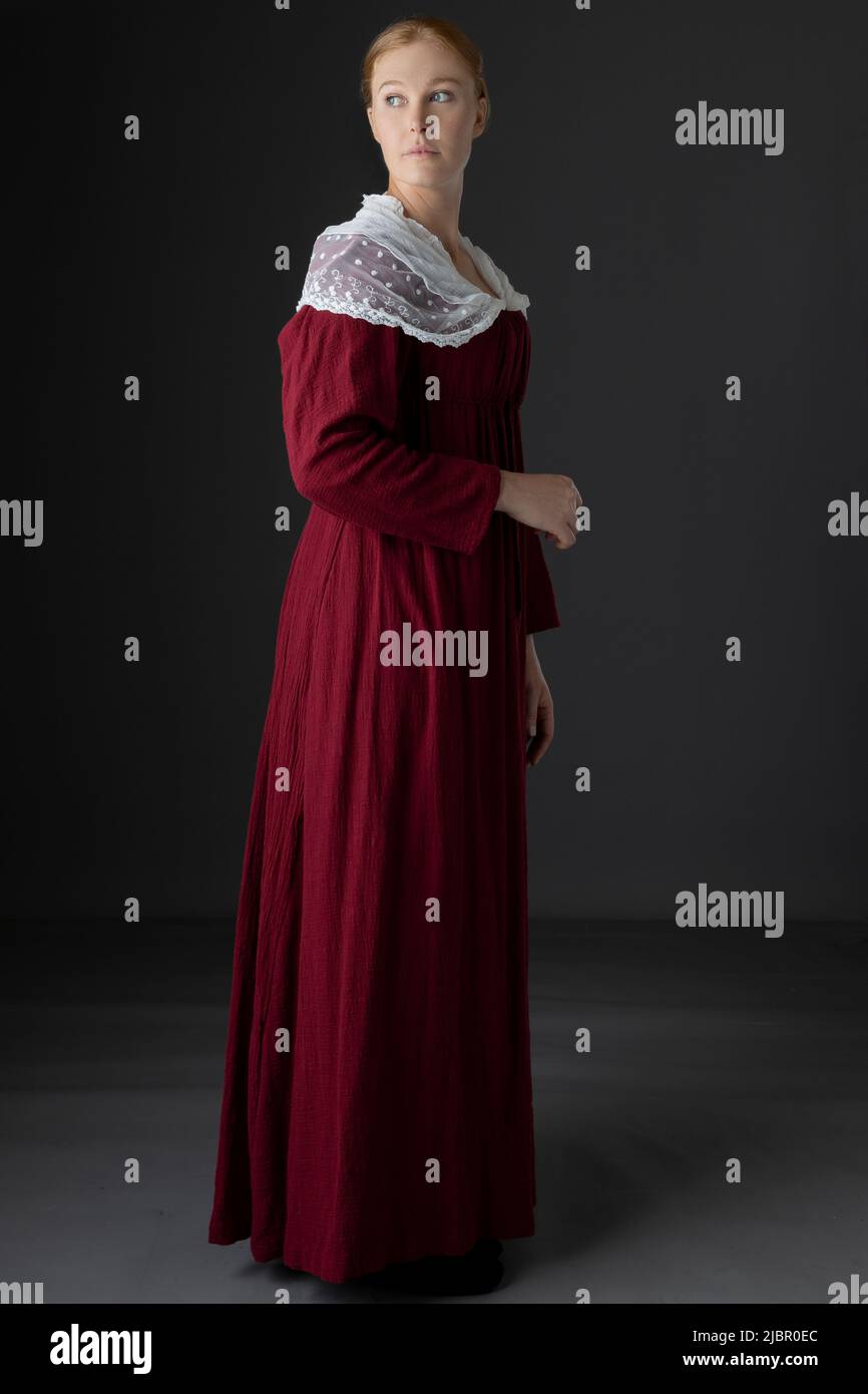 A working class Regency woman wearing a red dress Stock Photo - Alamy