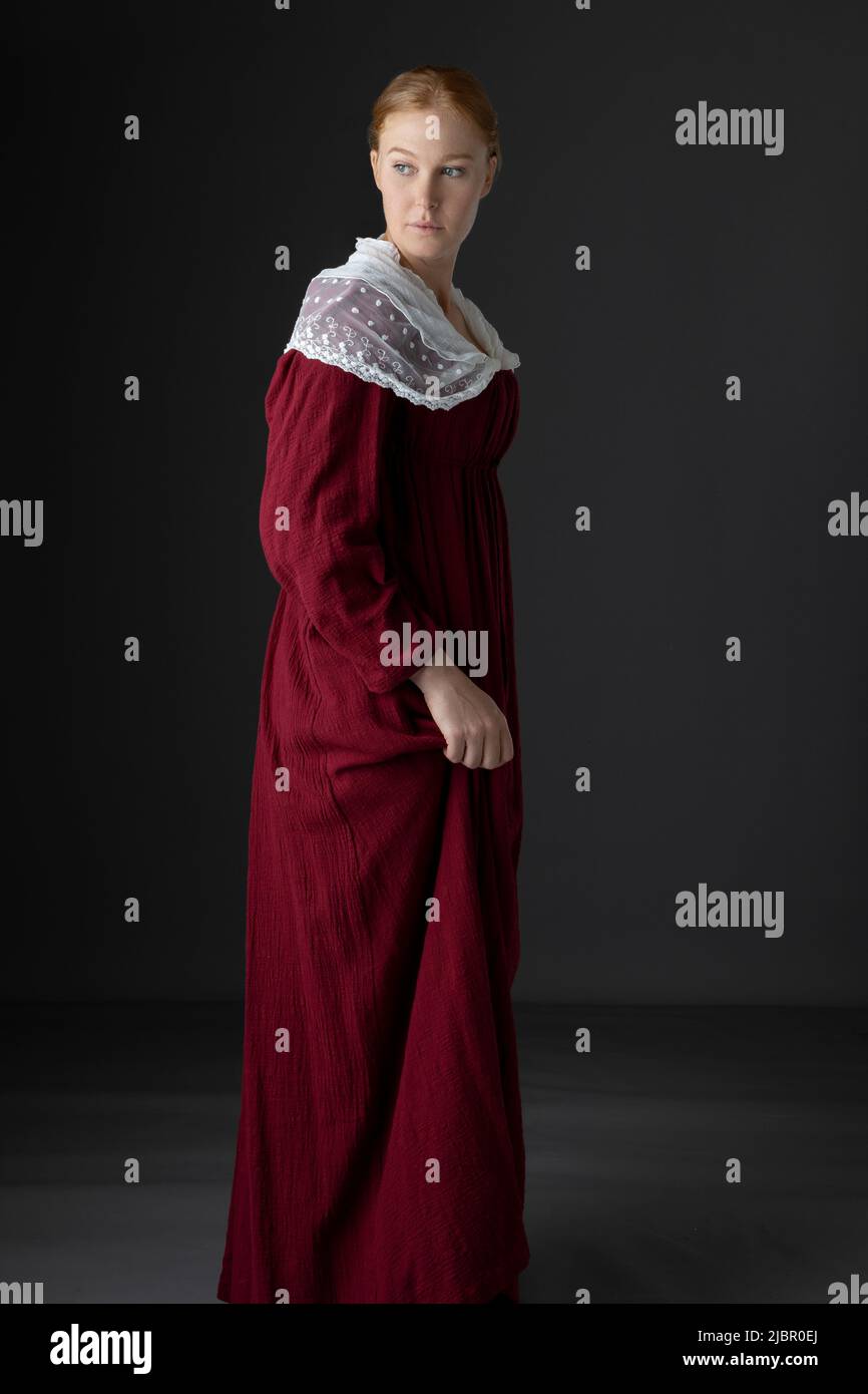 A working class Regency woman wearing a red dress Stock Photo - Alamy