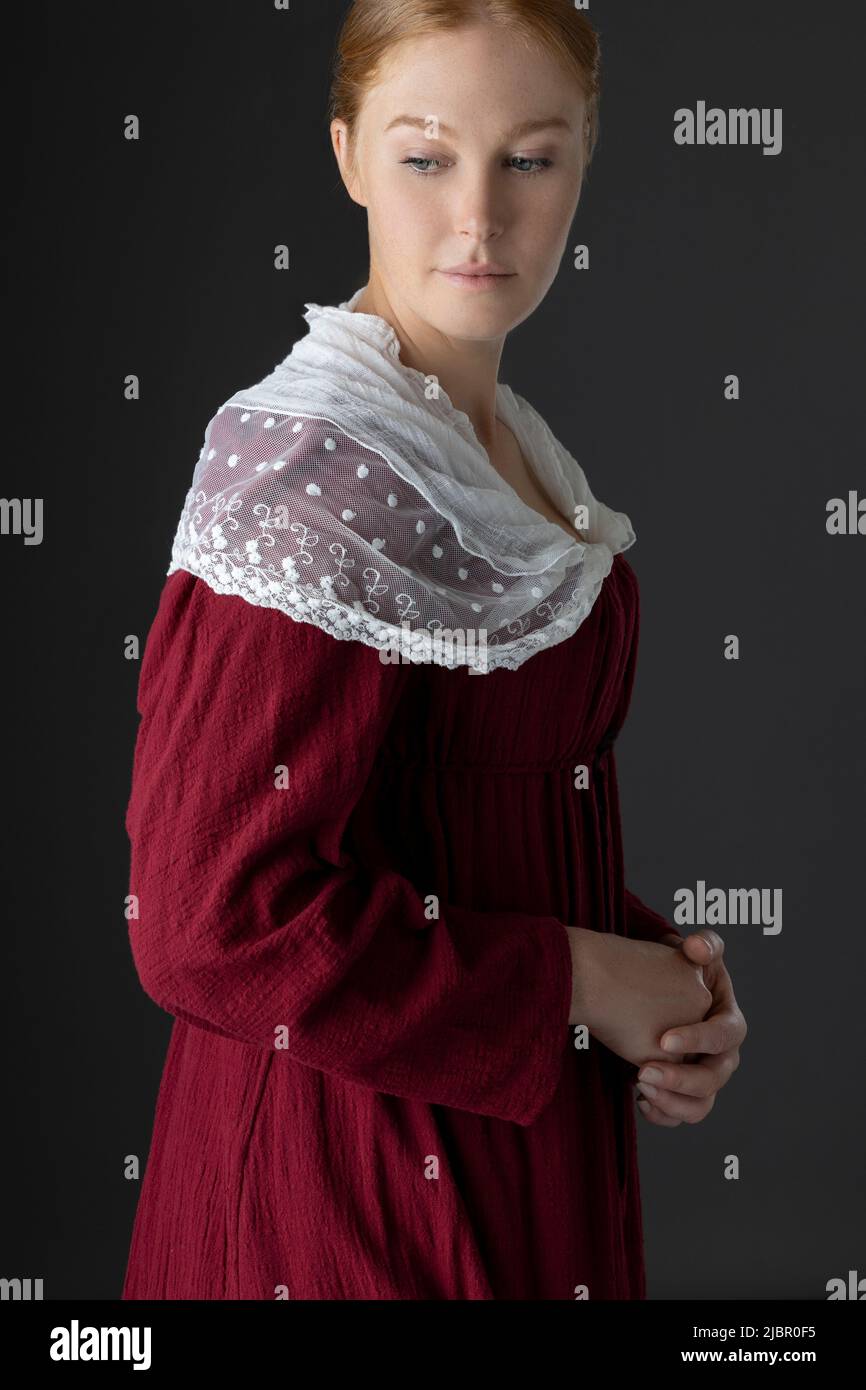 A working class Regency woman wearing a red dress Stock Photo - Alamy