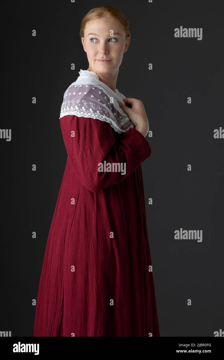 A working class Regency woman wearing a red dress Stock Photo - Alamy
