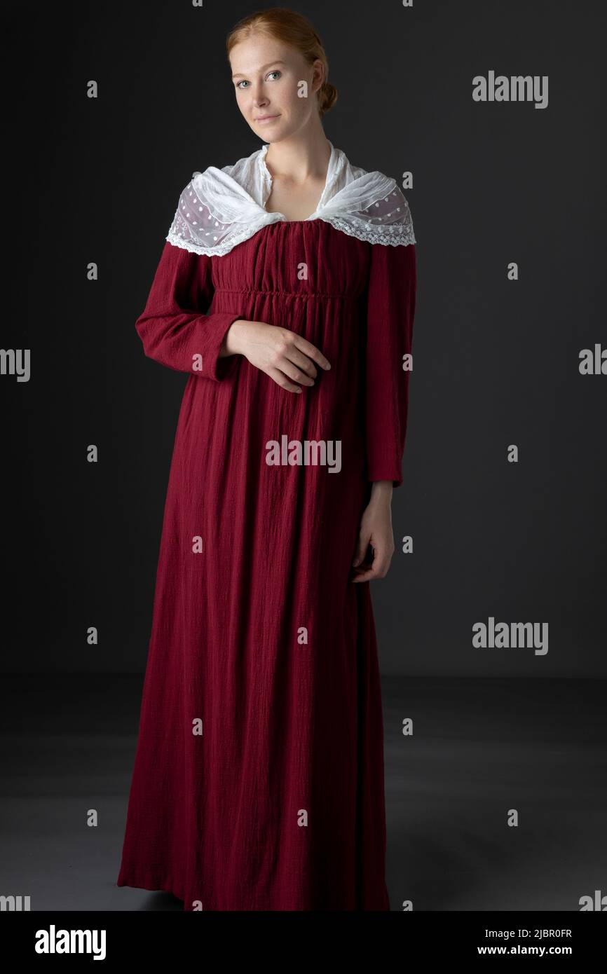 A working class Regency woman wearing a red dress Stock Photo - Alamy