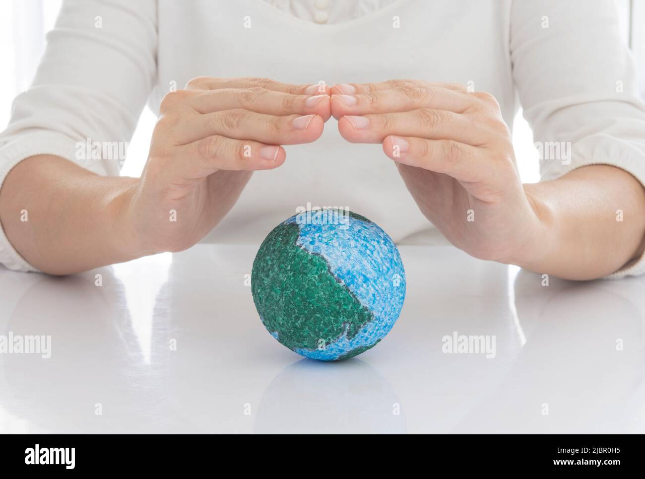 Image of human hands defending World. Concept of Save the Earth Stock ...