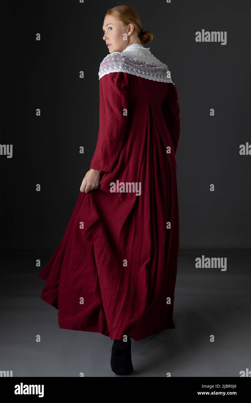 A working class Regency woman wearing a red dress Stock Photo - Alamy