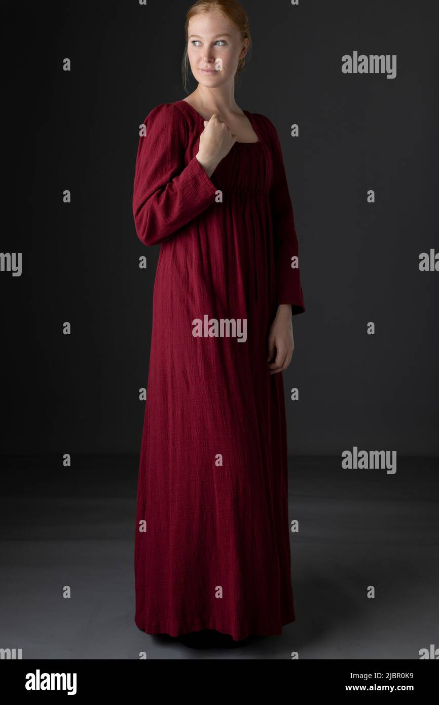 A working class Regency woman wearing a red dress Stock Photo - Alamy