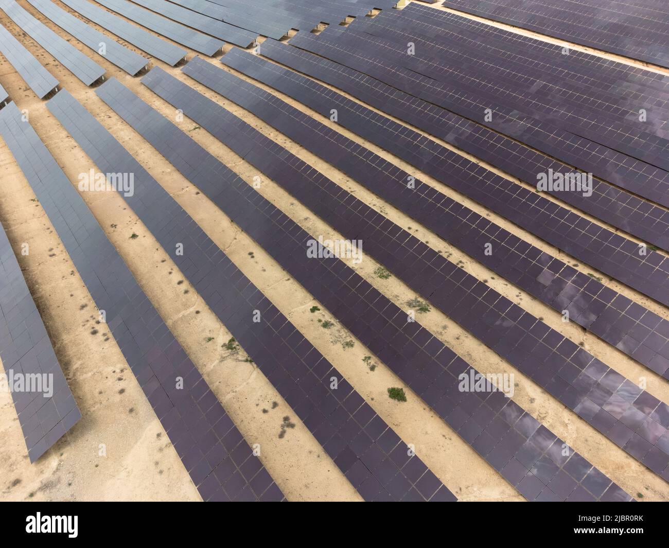 Aerial view over solar panels in a solar power station in Spain ...