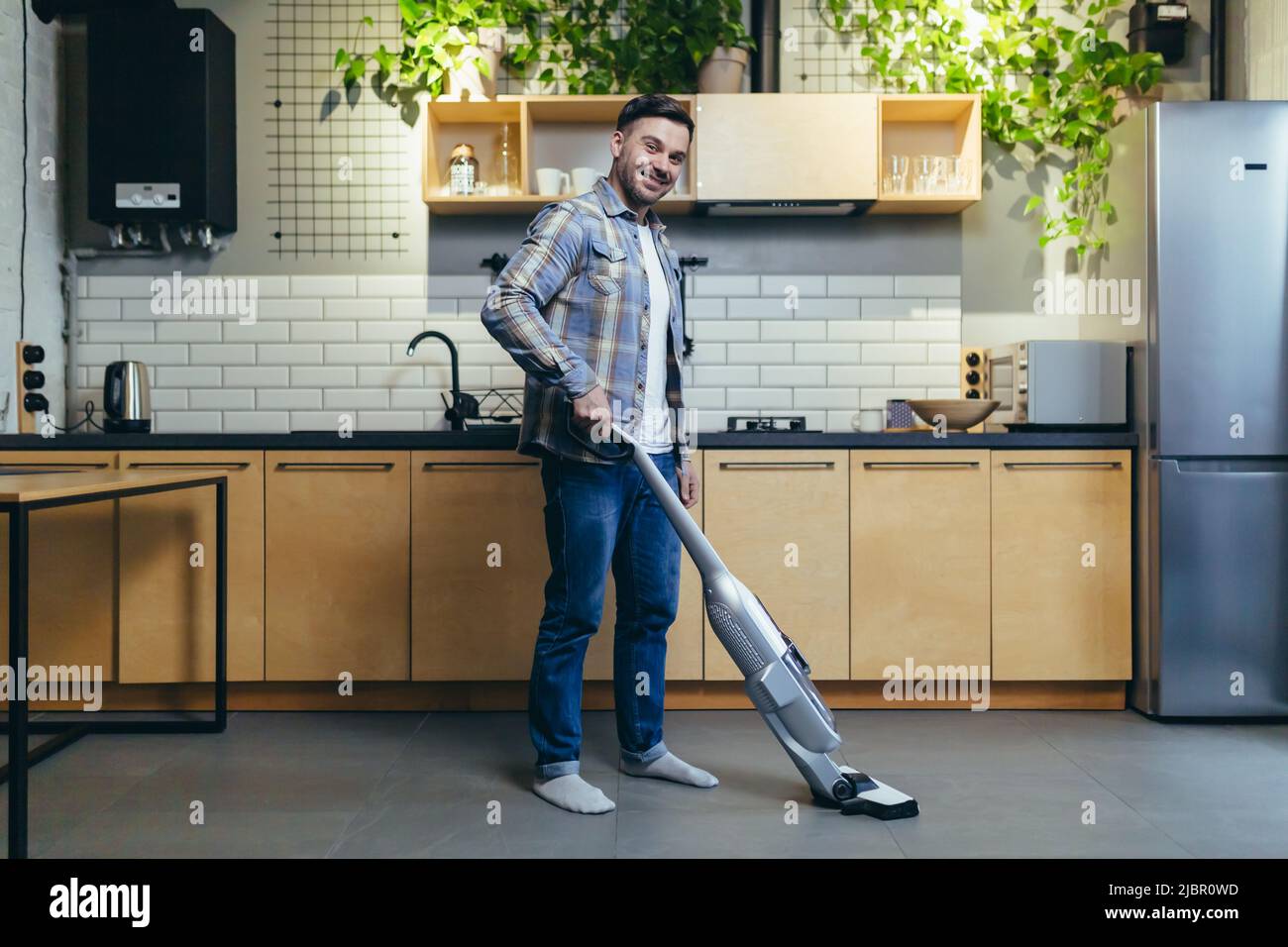 Husband doing housework hi-res stock photography and images - Alamy