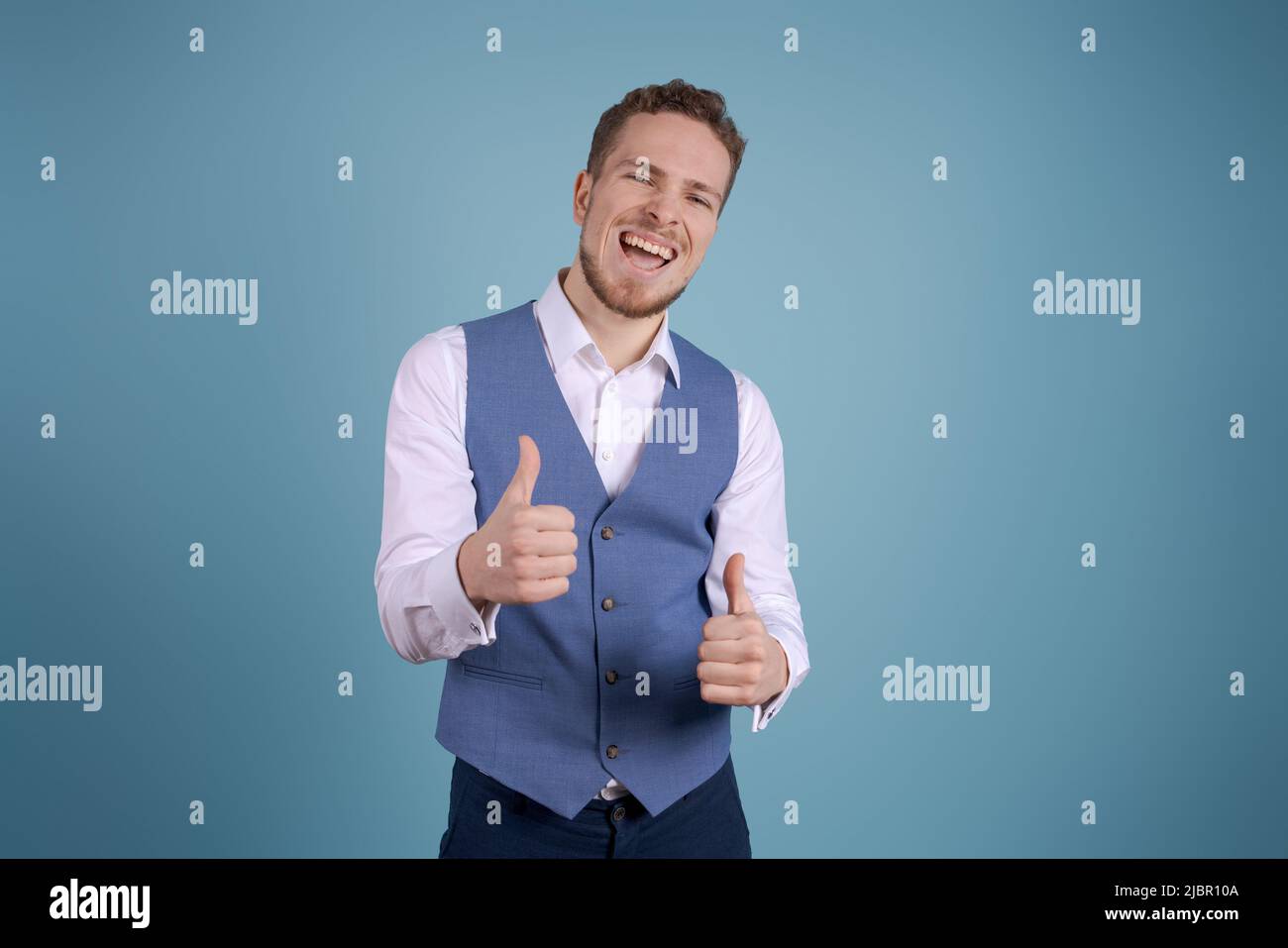 Portrait handsome young man makes normal gesture, shows consent, loves ...