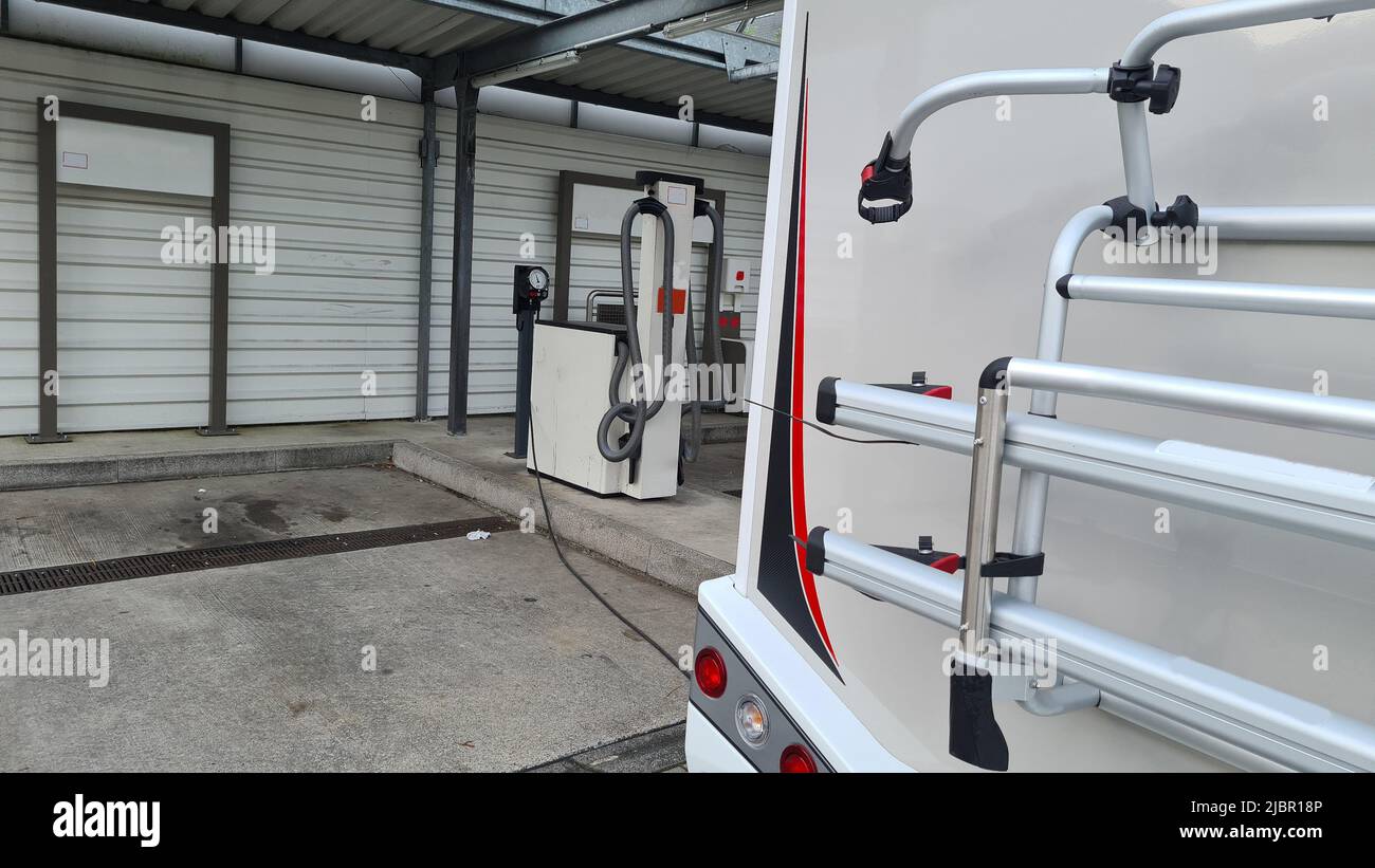 Mobile homes at a gas station here the tire pressure is checked Stock ...