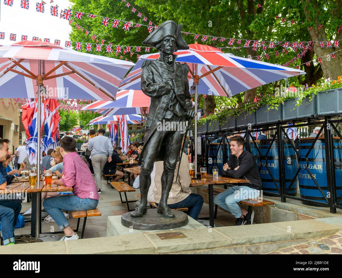 Statue of Admiral Lord Nelson in seating area outside the Trafalgar pub ...