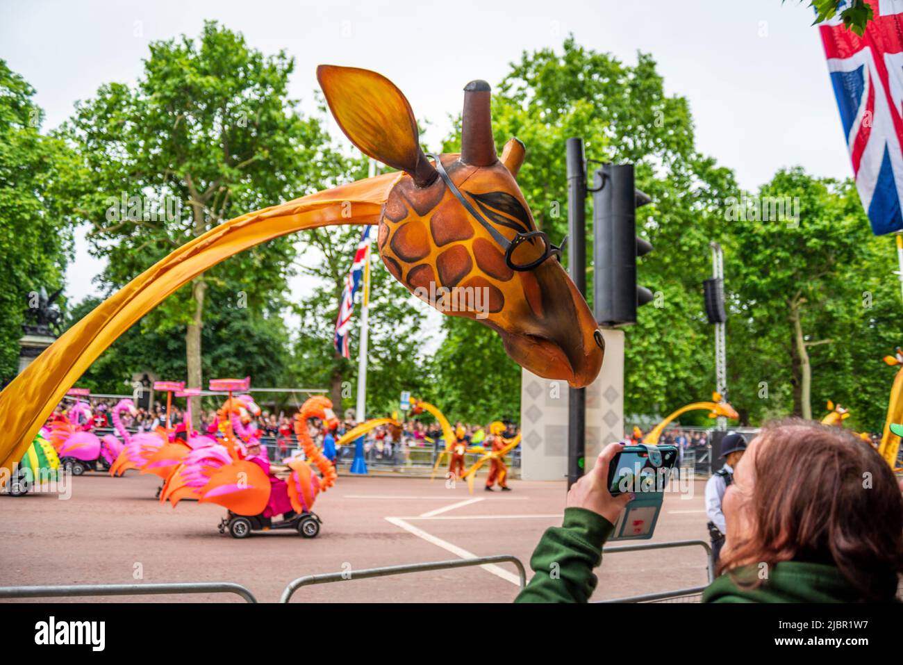 Large giraffe puppet interacting with crowd at the Queen's Platinum ...