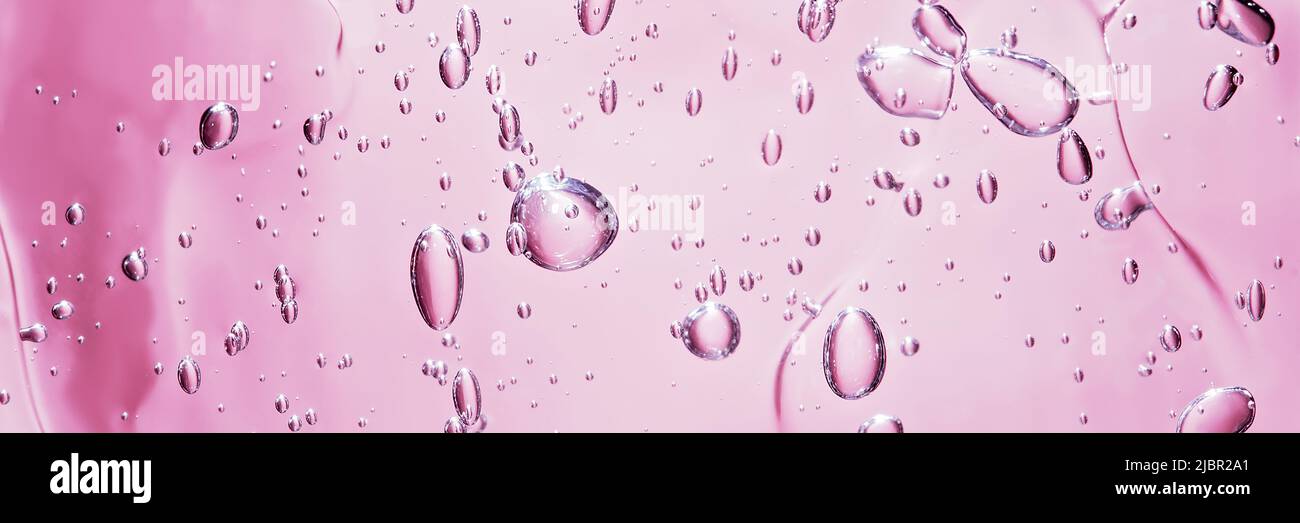 Close up macro Aloe vera gel cosmetic texture pink background with ...