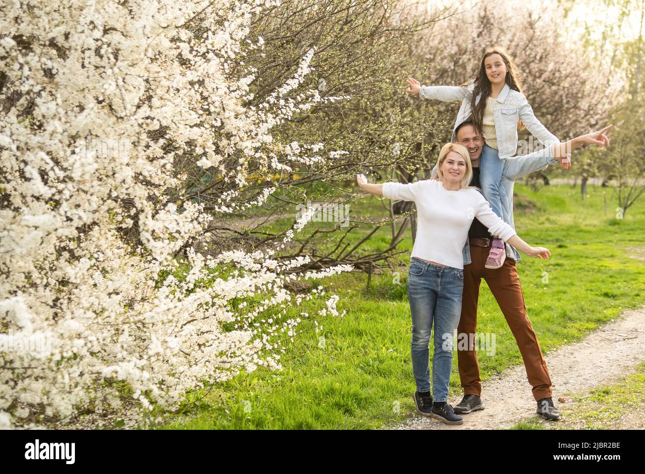 Family and child outdoors in spring nature, resting Stock Photo - Alamy
