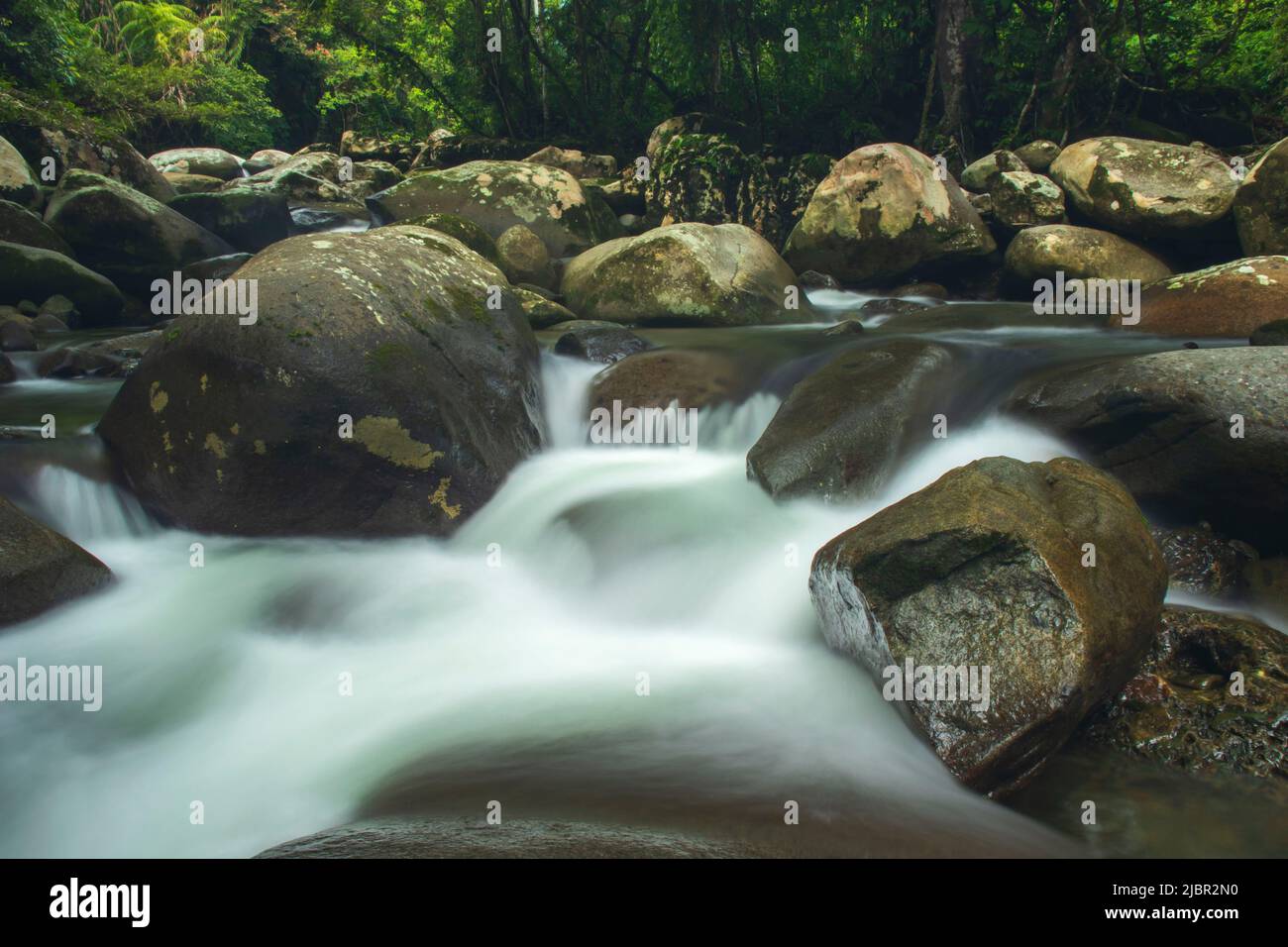 Photo of water flowing between rocks, Mountala river, Aceh, Indonesia ...