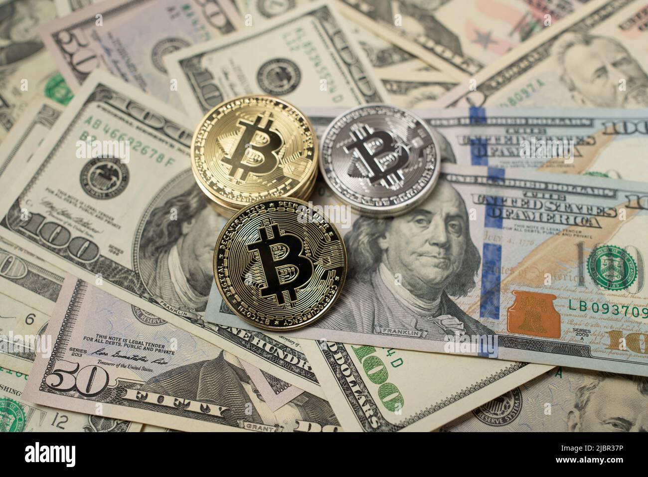 Bitcoin Crypto currency with US Dollar banknotes. Crypto Coins and 100 ...