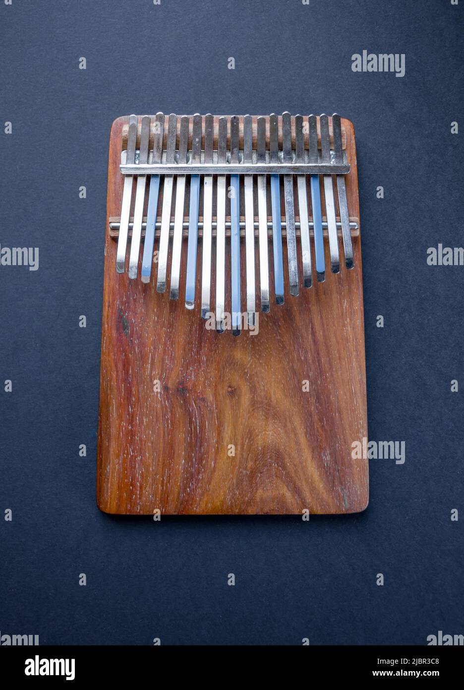 Traditional wooden kalimba isolated on black background Stock Photo - Alamy