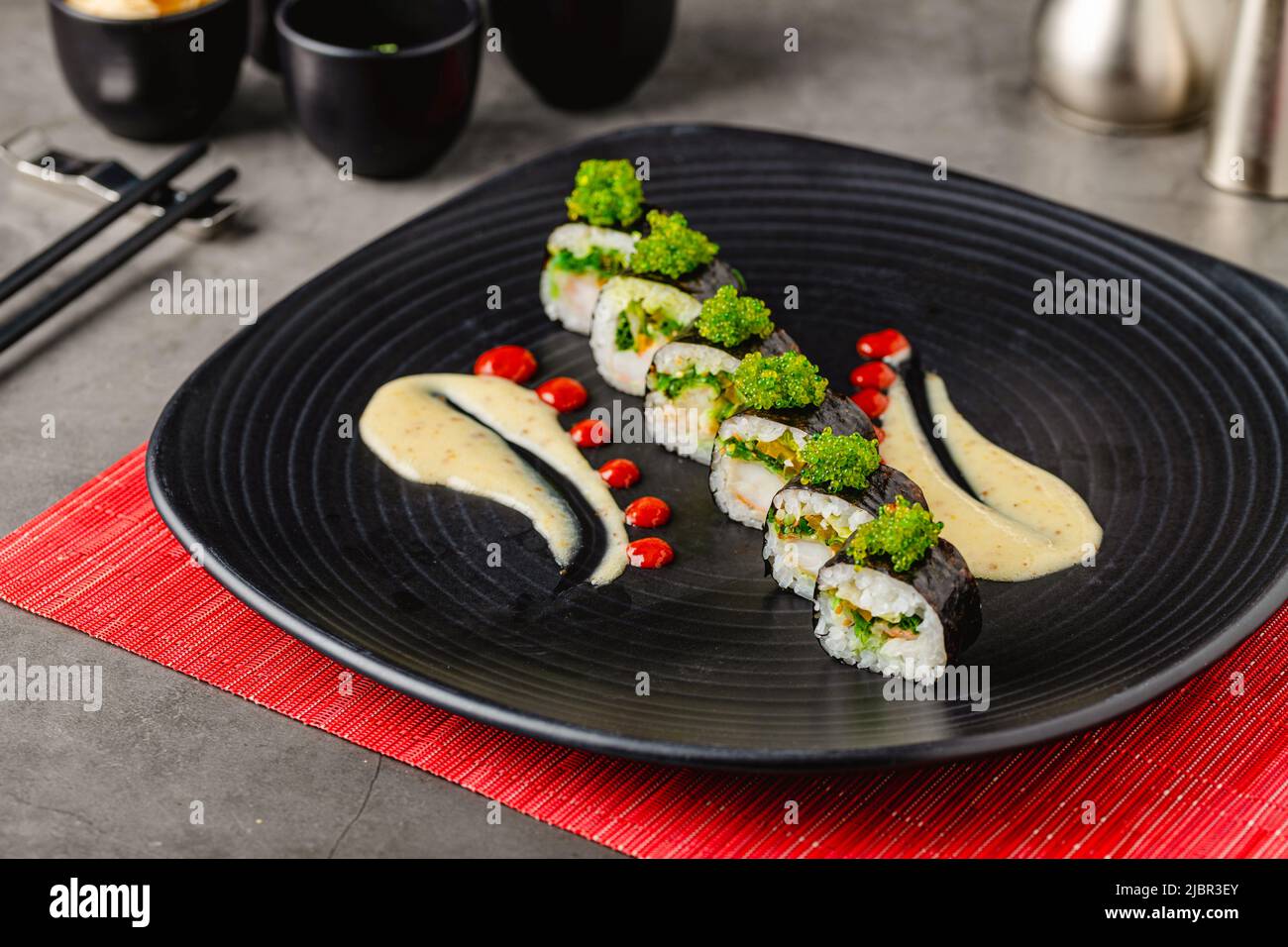 Sushi set of various products on a black stone plate Stock Photo - Alamy