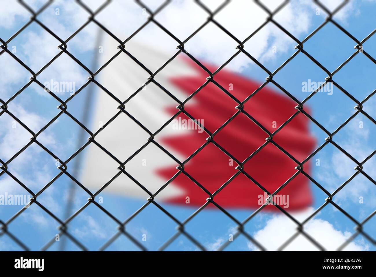 A steel mesh against the background of a blue sky and a flagpole with ...