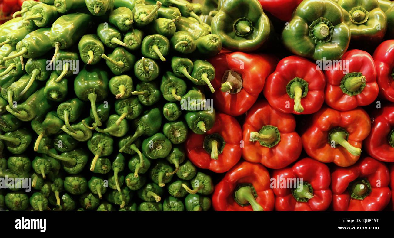 Trendy beautiful organic green and red paprika pepper on the market ...
