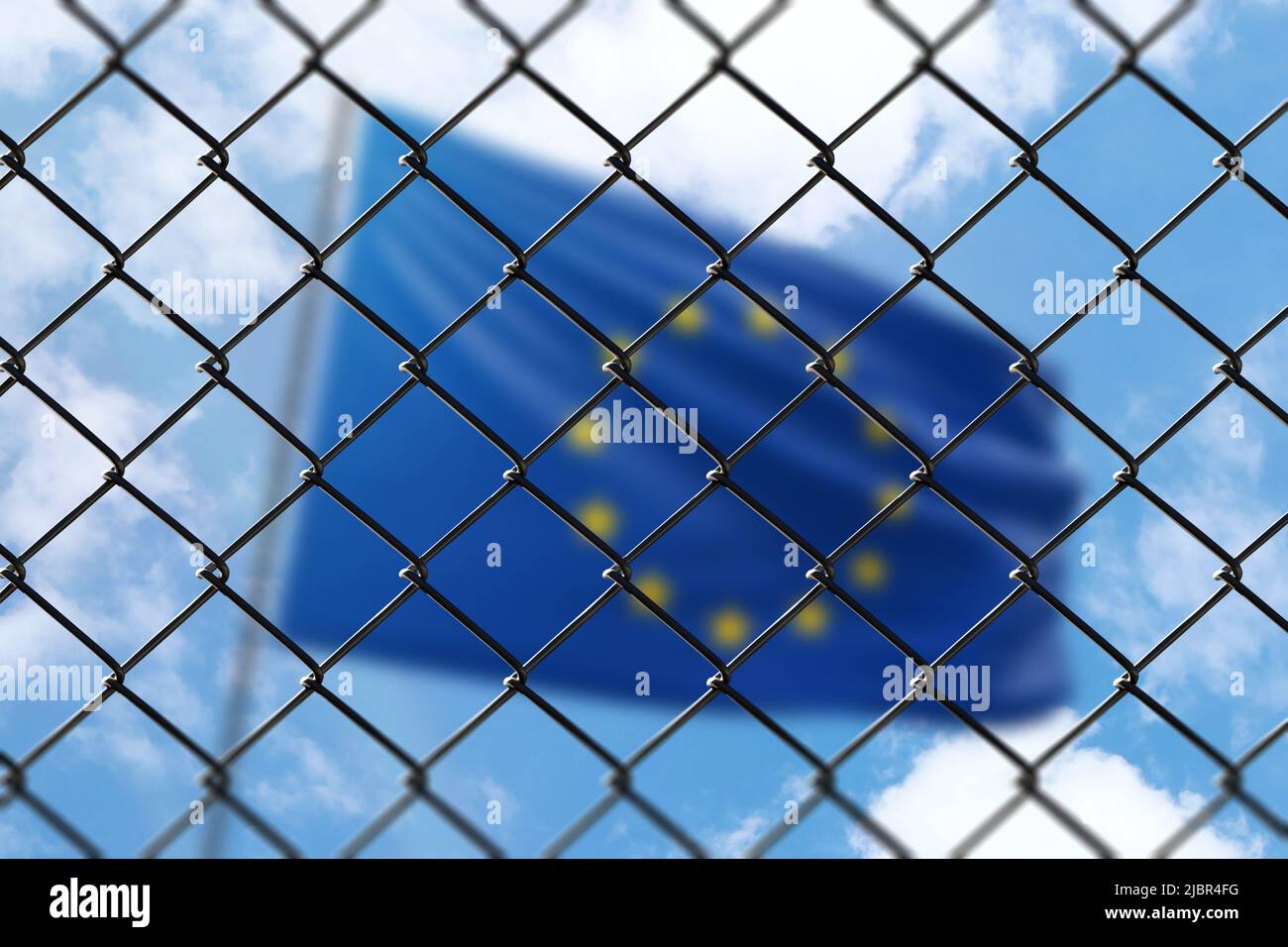 A steel mesh against the background of a blue sky and a flagpole with ...